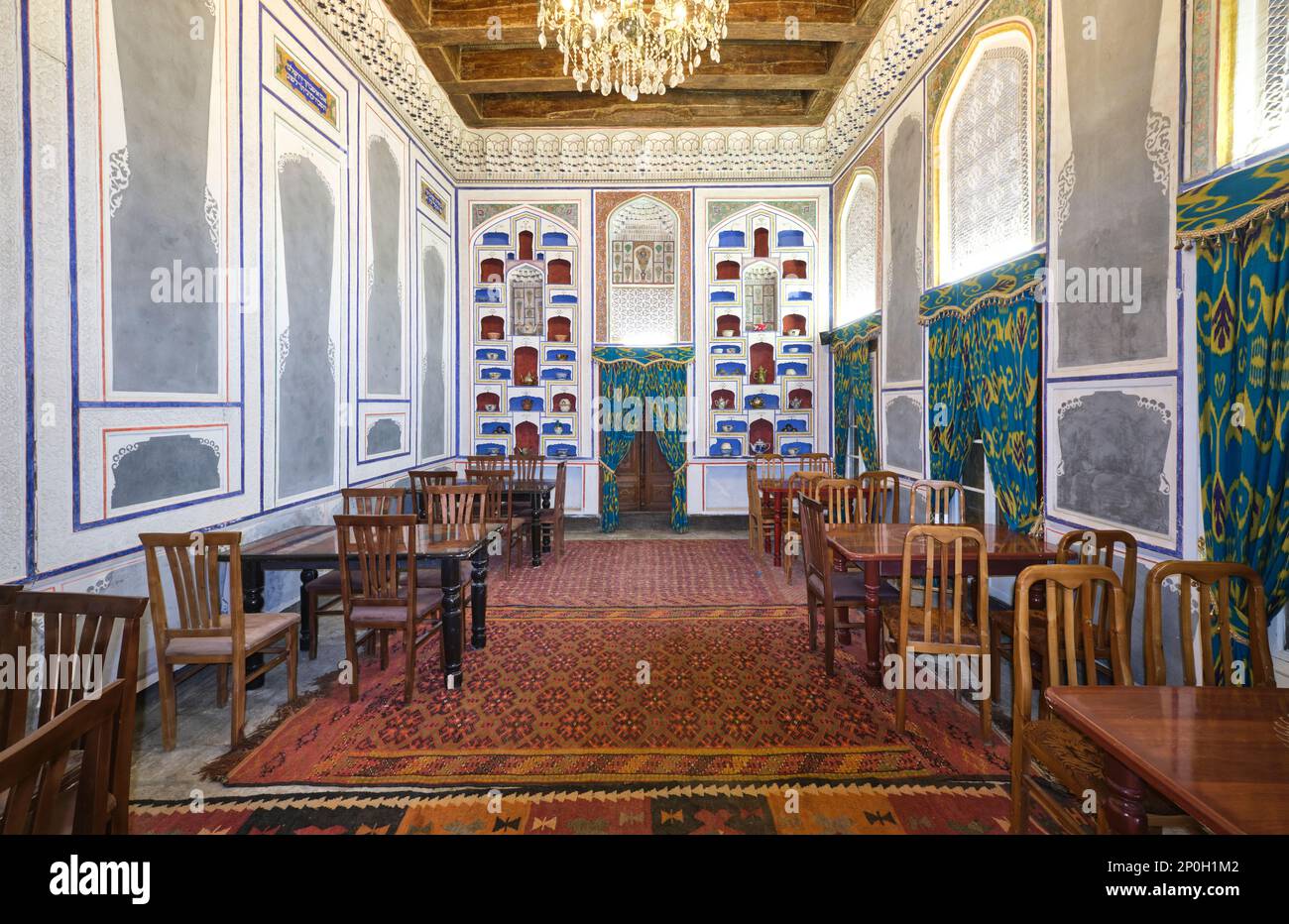 The grand, receiving, living room, now used as a restaurant with tables ...