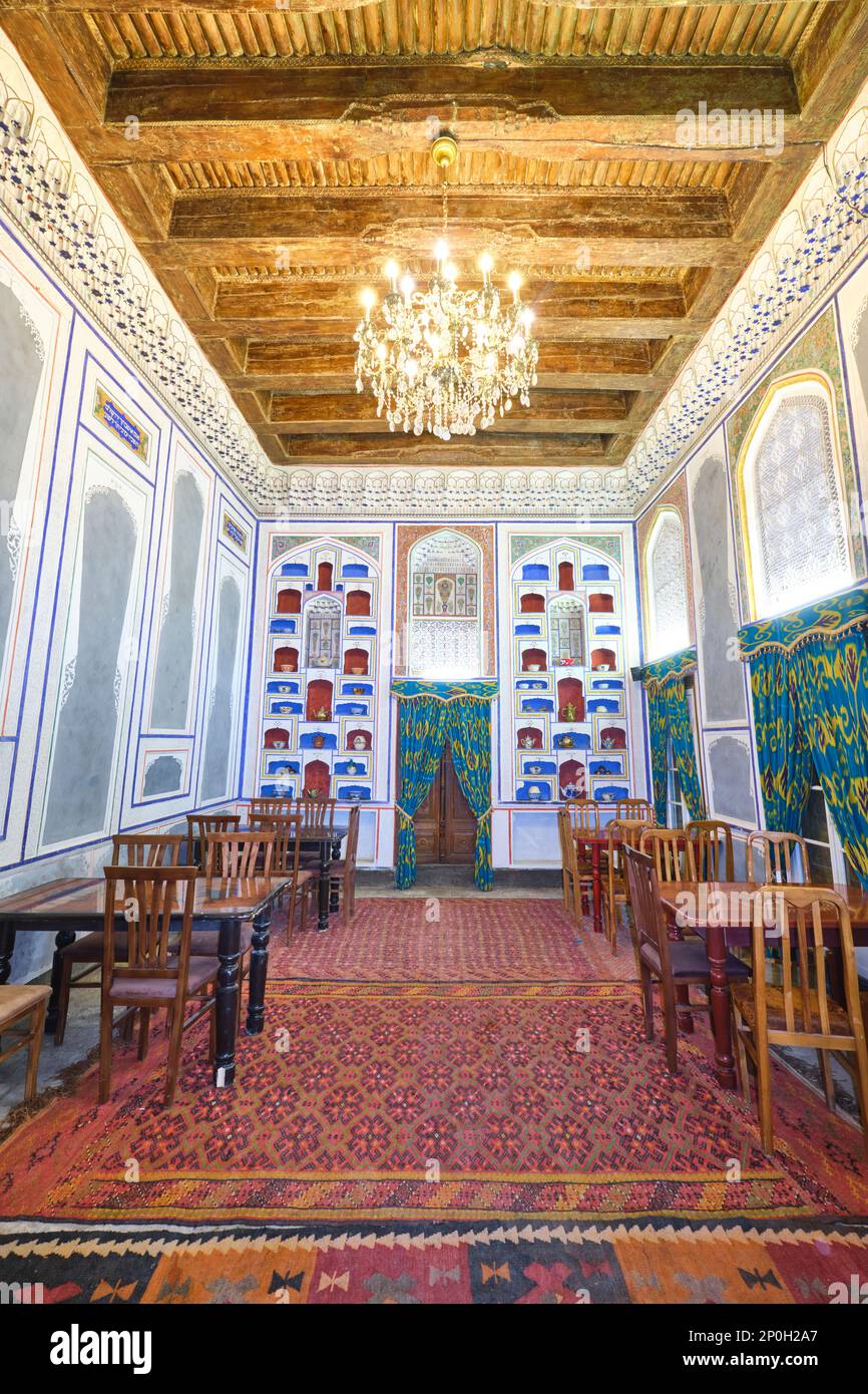 The grand, receiving, living room, now used as a restaurant with tables ...