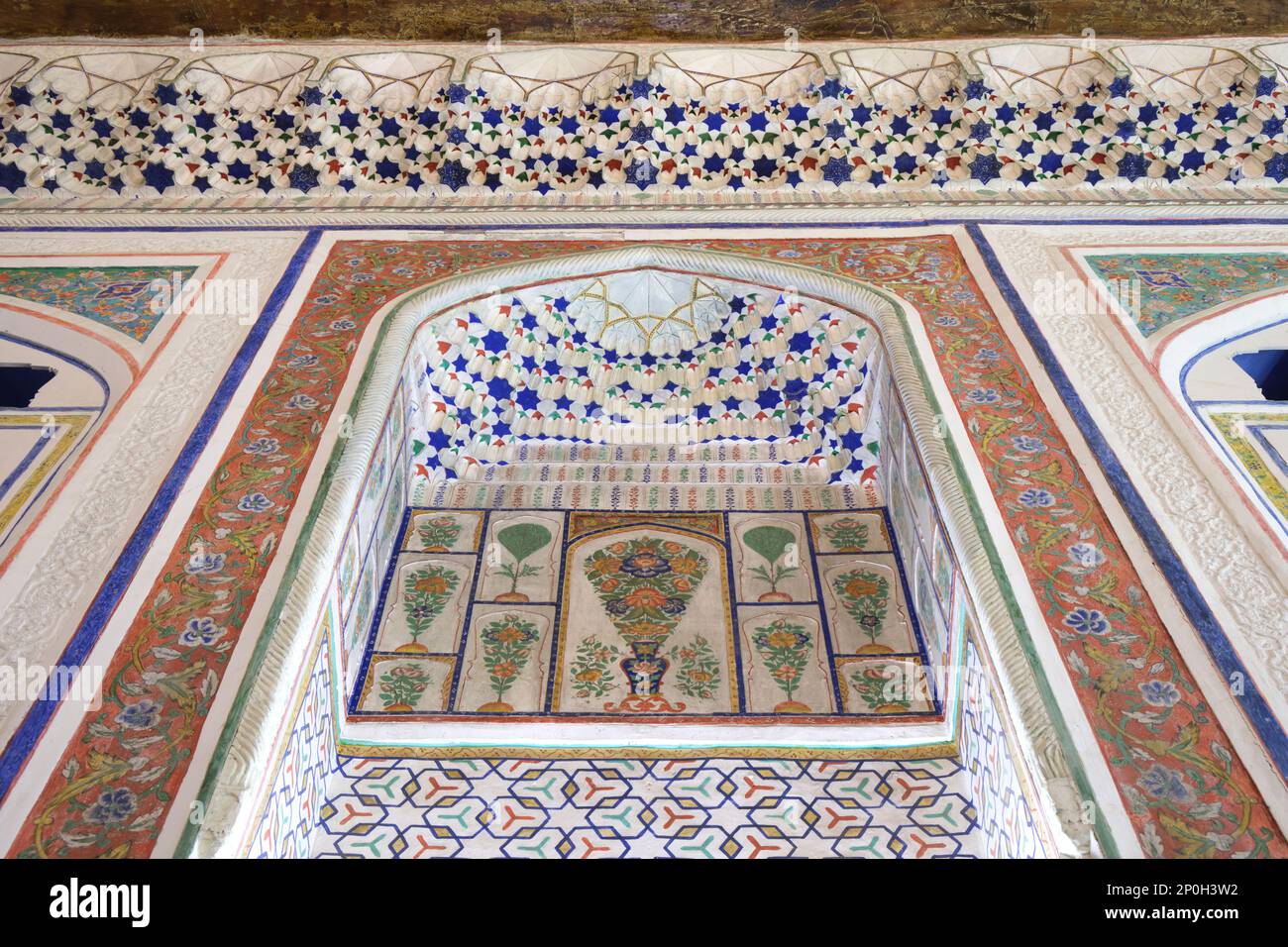 Close up, detail of the fine stalactite, muqarnas painted plaster work ...