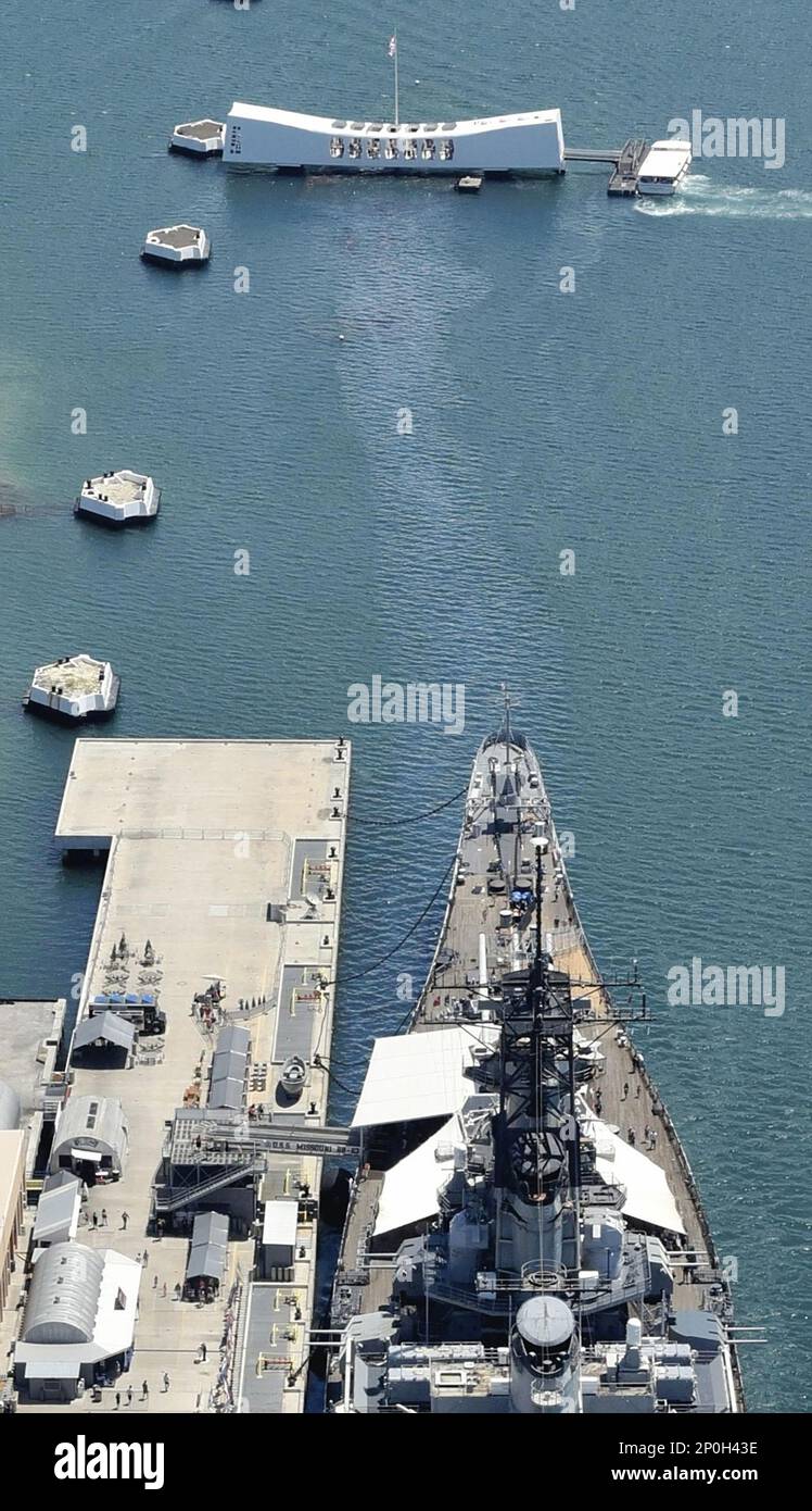 An aerial photo shows the USS Missouri (bottom) and the memorial ...