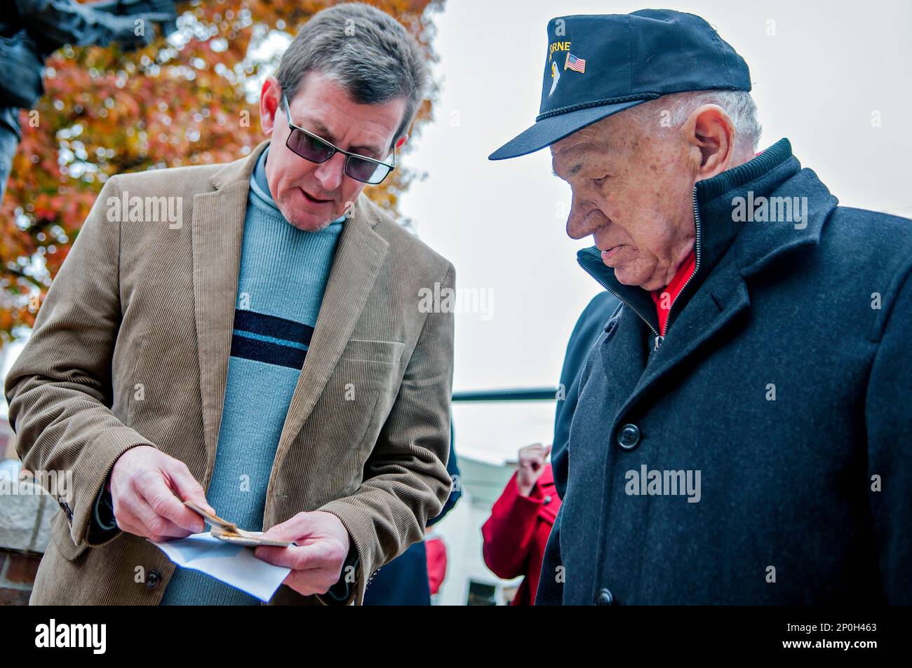 Samuel Fee of Calhoun (left) shows an old newspaper clip to his uncle ...