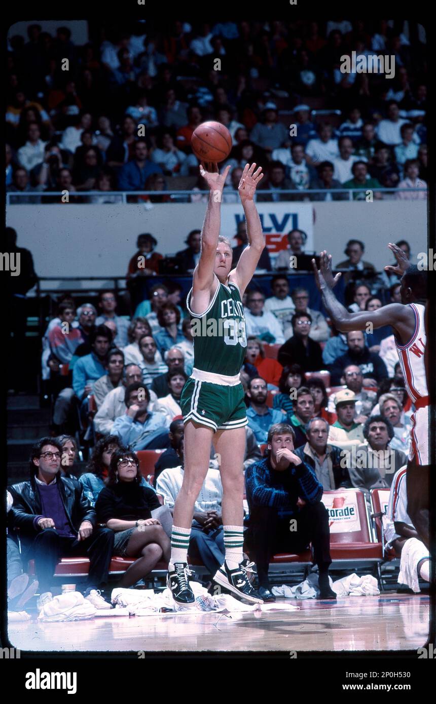 Late 1980's: Larry Bird of the Boston Celtics with a jump shot versus ...
