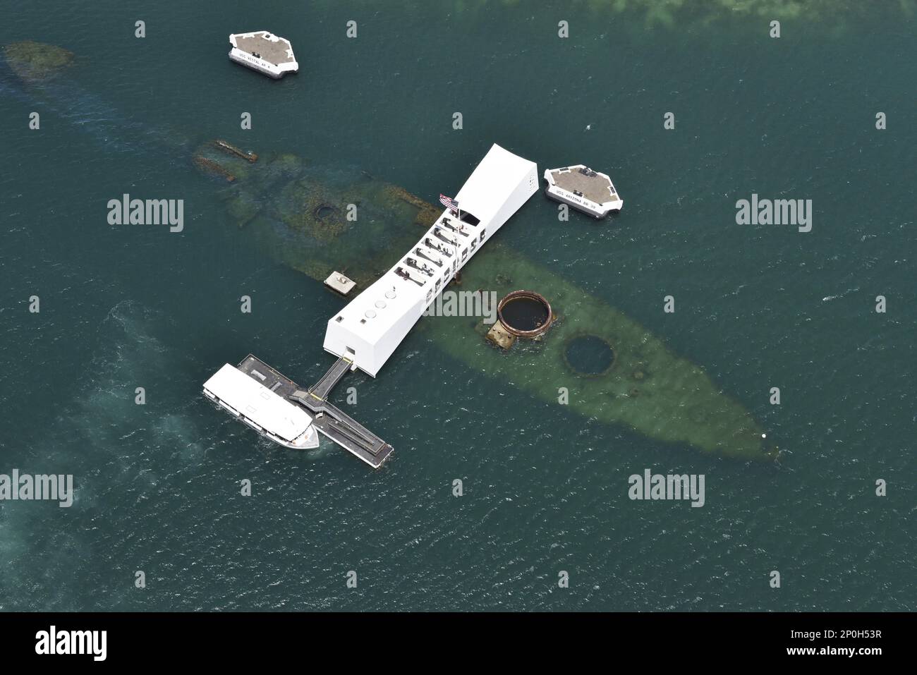 An aerial photo shows the sunken battleship USS Arizona and memorial ...