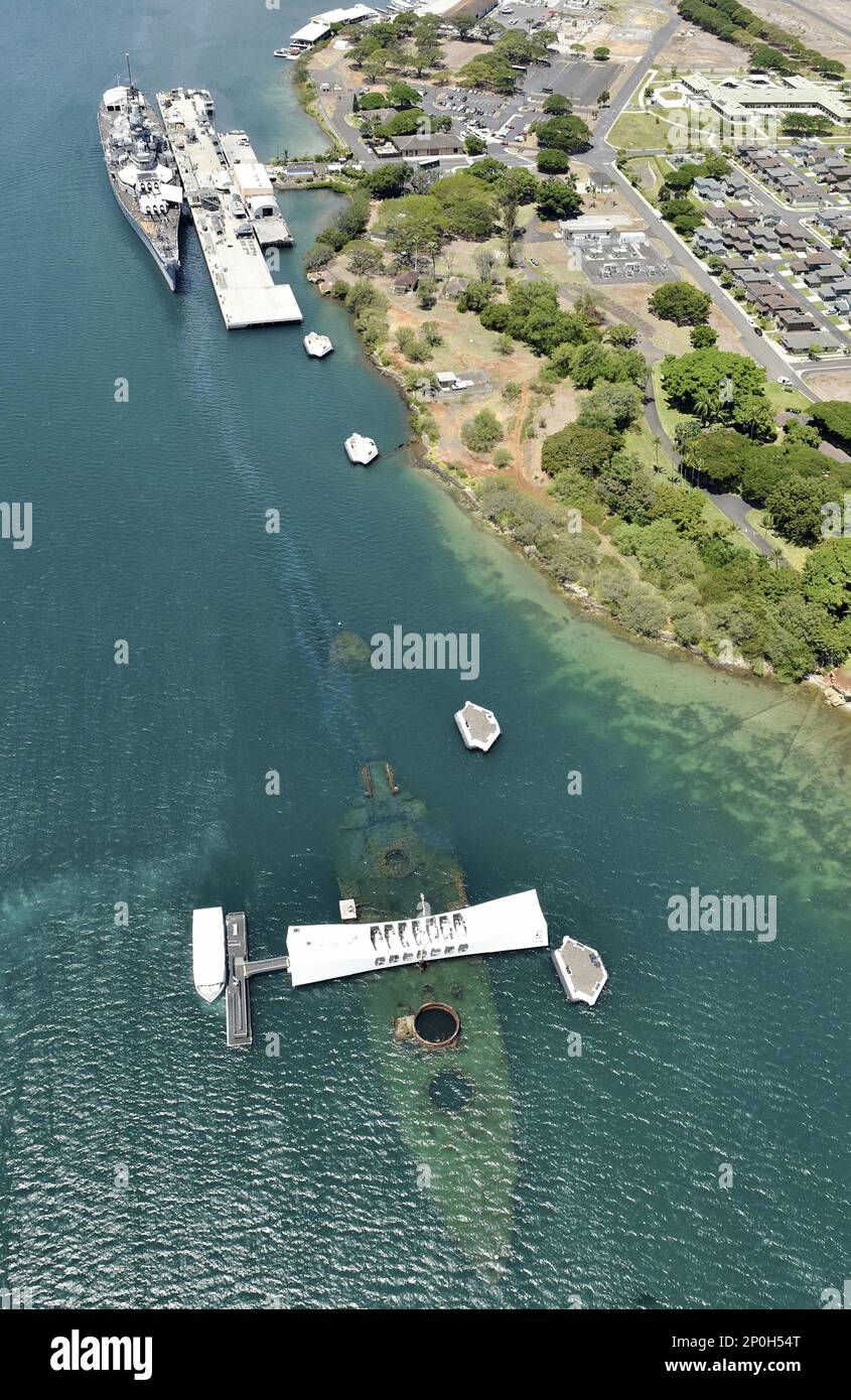 An aerial photo shows the sunken battleship USS Arizona and memorial ...