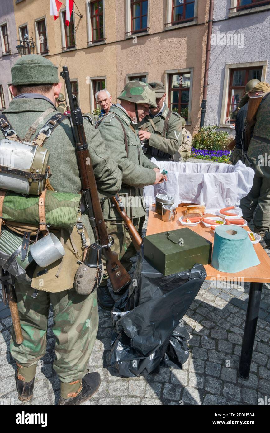 Reenactors at field kitchen, before reenactment of WW2 battle, City ...