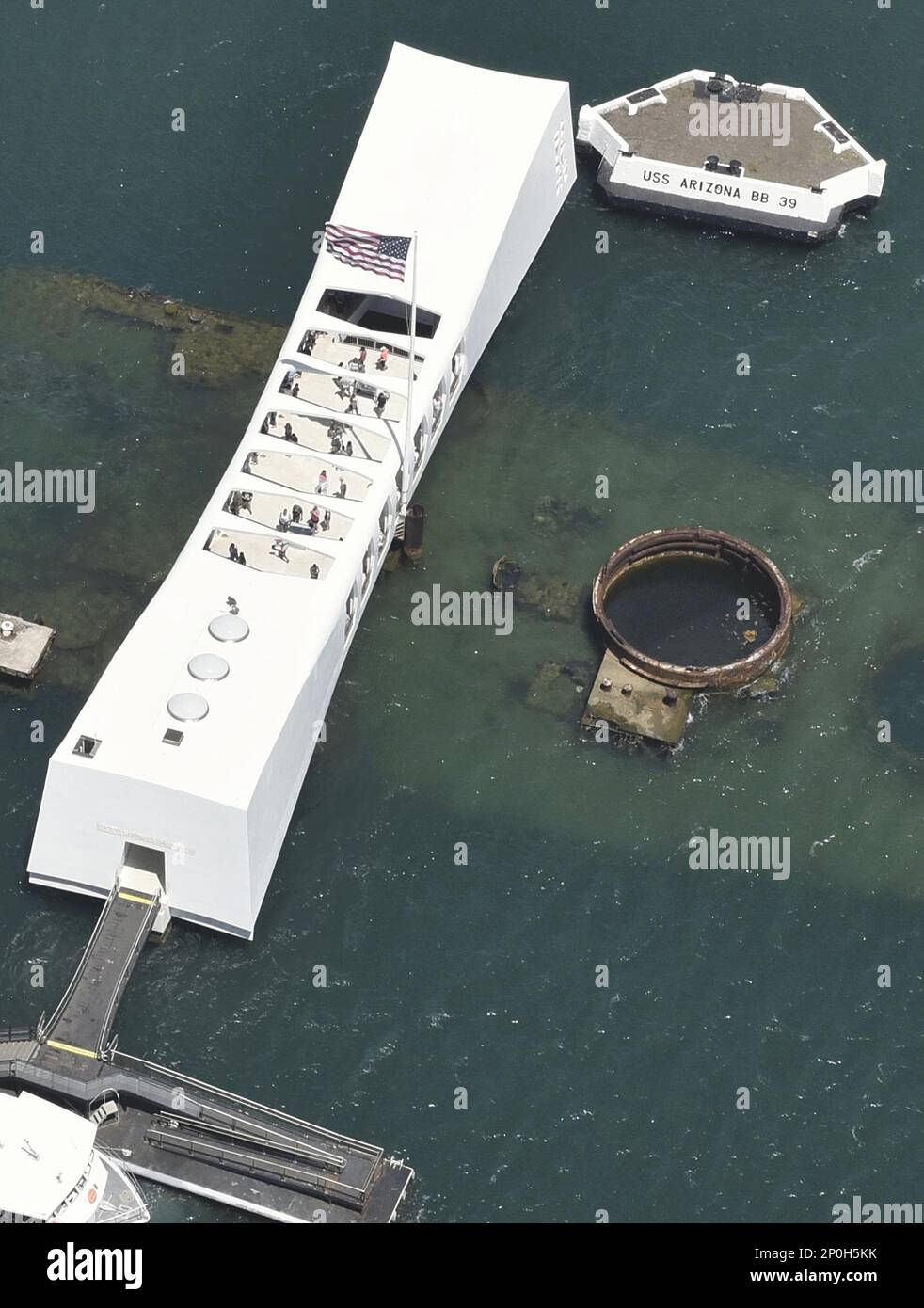 An aerial photo shows the sunken battleship USS Arizona and memorial ...