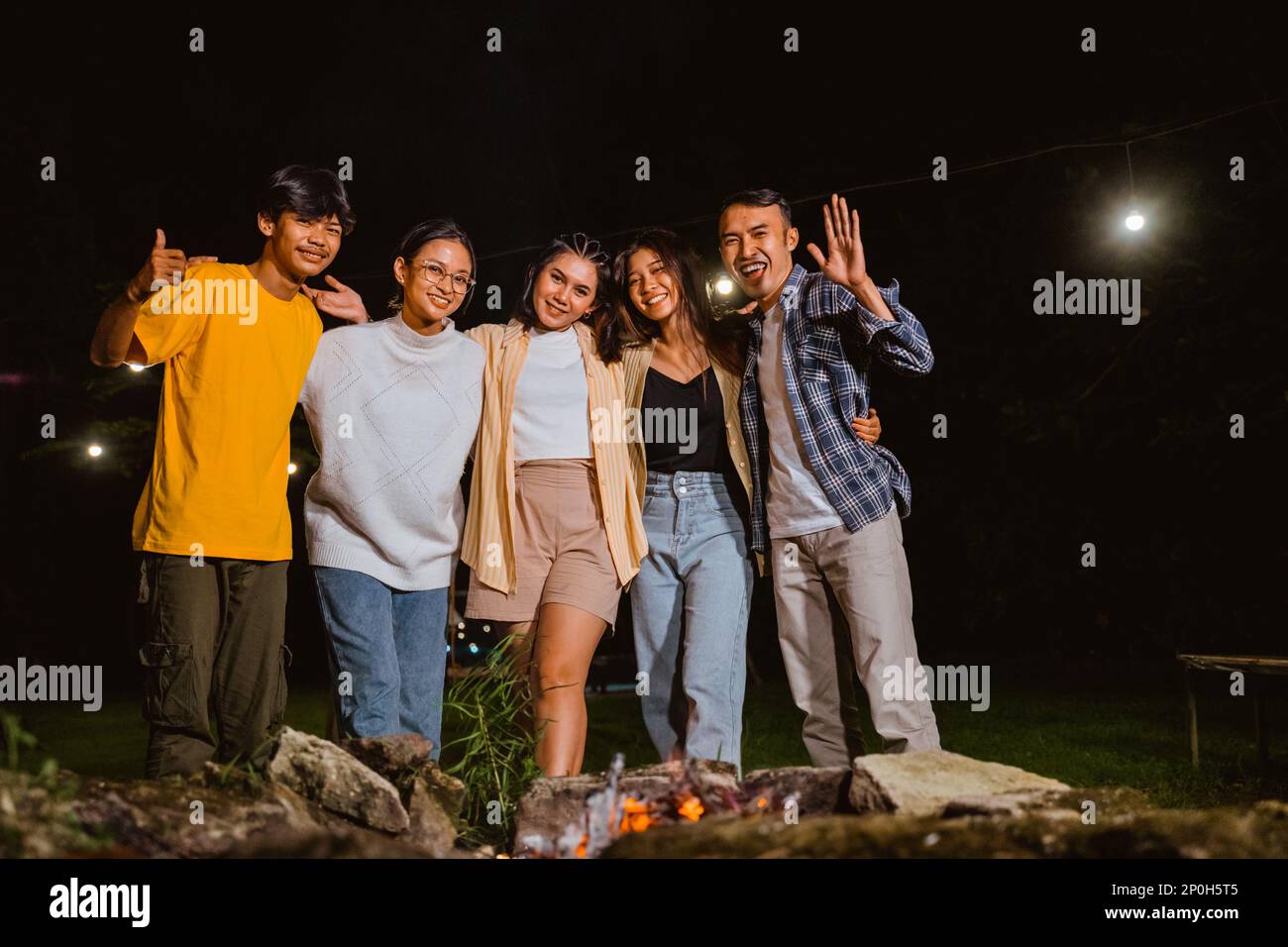 a group of people embrace each other Stock Photo - Alamy