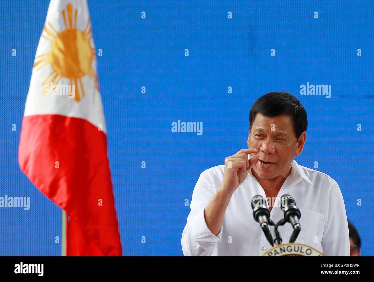 Philippine President Rodrigo Duterte gestures beside the Philippine ...