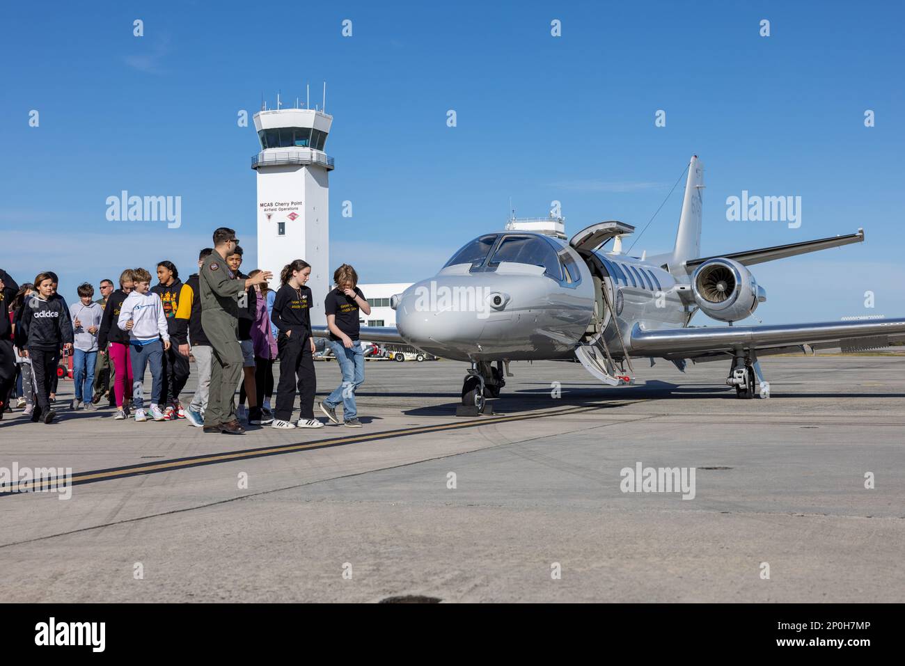 Students and teachers from Grover C. Fields Middle School learn about a ...