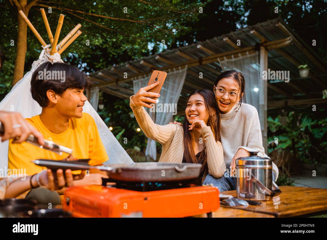 two beautiful women taking a groufie photo at the camp site Stock Photo ...
