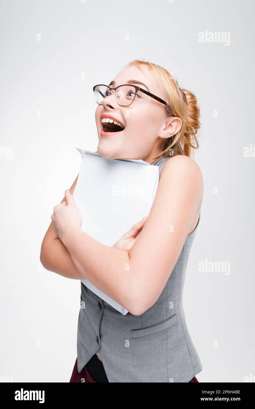 Nice girl in glasses extremely happy about success Stock Photo - Alamy
