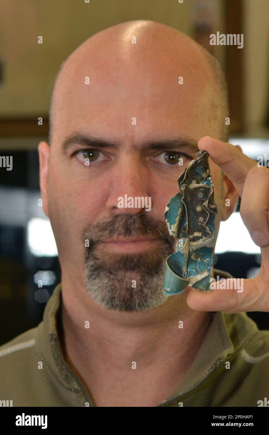 In this Dec. 4, 2016 photo, Brian Mundell holds a piece of a Japanese ...