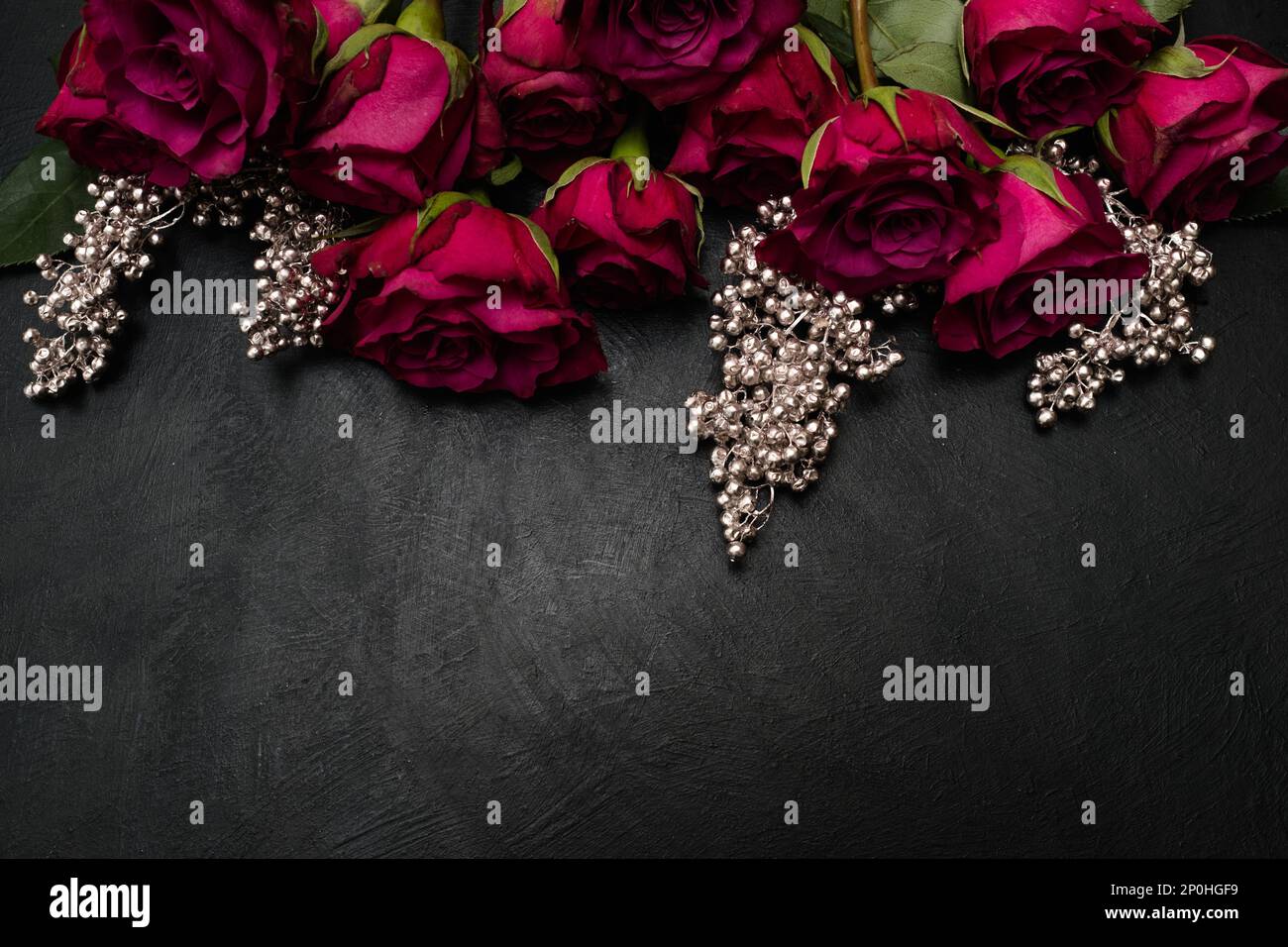 gothic wedding flowers burgundy roses arrangement Stock Photo - Alamy