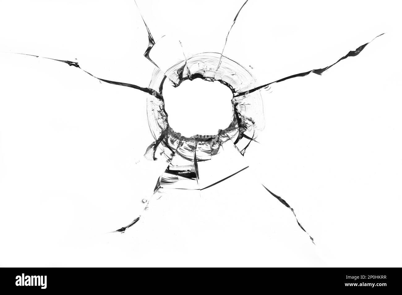 Detailed shot of bullet entry point on fractured glass surface Stock ...