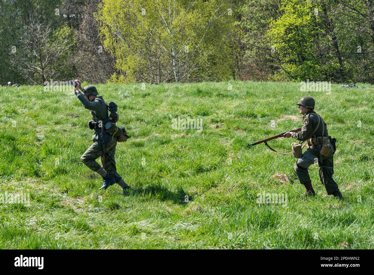 German soldiers surrendering to US troops at WW2 battle reenactment in Jelenia Gora, Poland ...