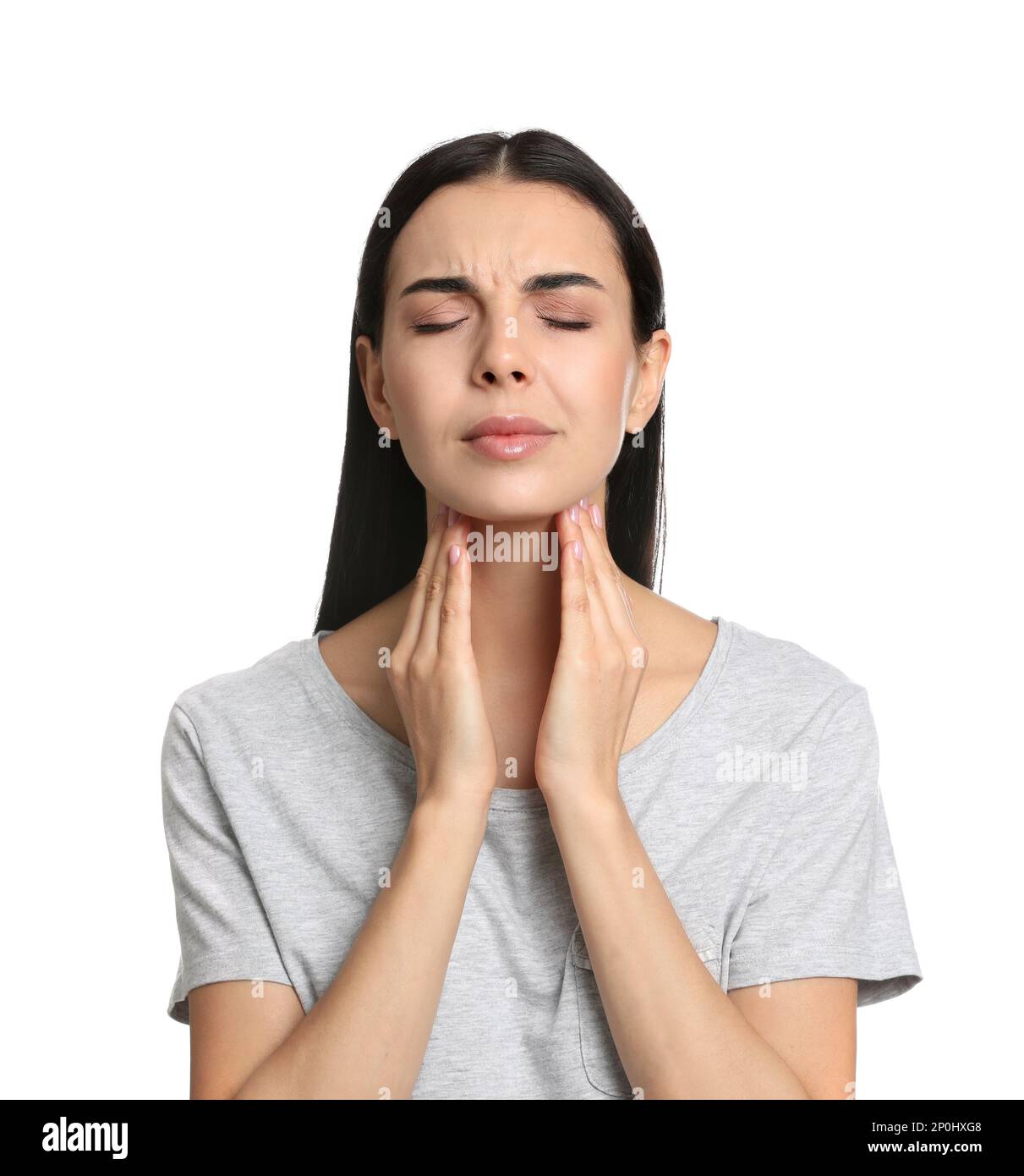 Young woman doing thyroid self examination on white background Stock ...