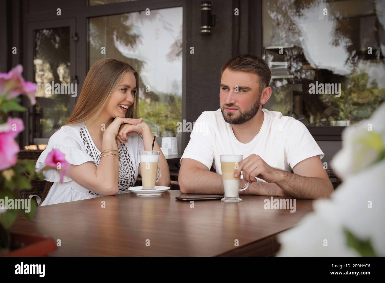 Young man having boring date with talkative girl in outdoor cafe Stock ...