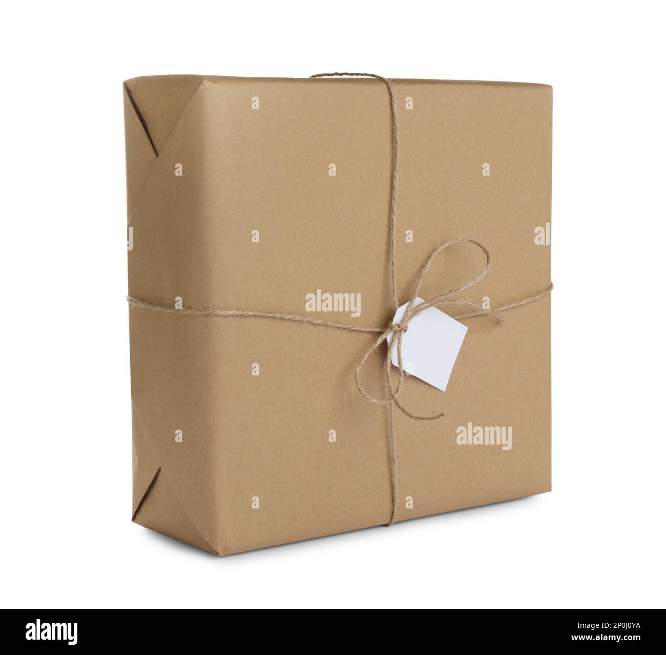 Parcel wrapped in kraft paper with tag on white background Stock Photo ...