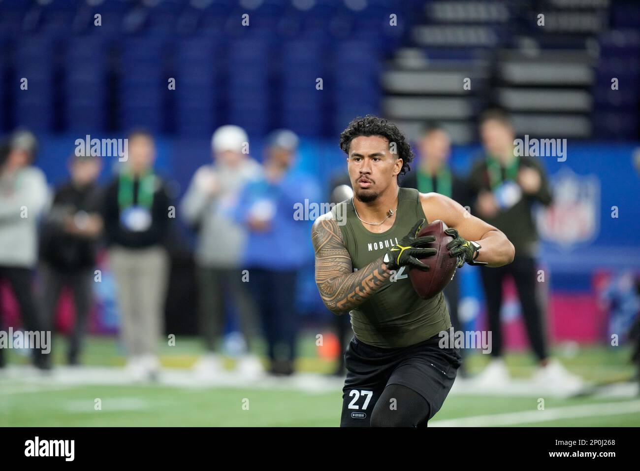 Oregon linebacker Noah Sewell runs a drill at the NFL football scouting ...