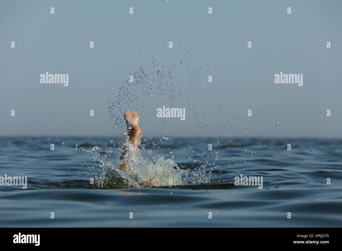 Drowning woman's leg sticking out of sea Stock Photo - Alamy