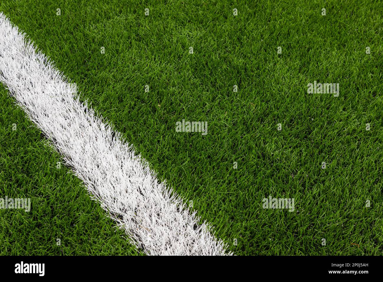 Photo of a green synthetic grass sports field with white line shot from ...