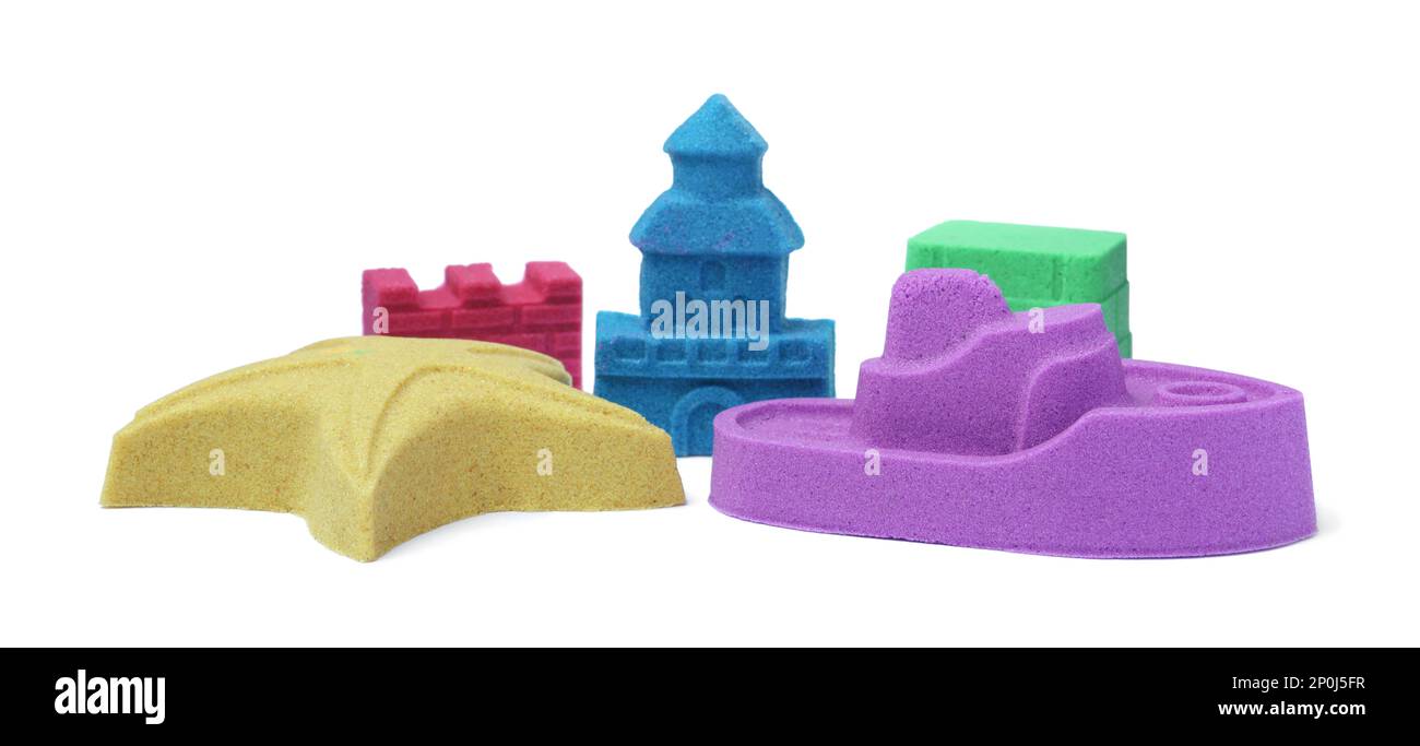 Different figures made of kinetic sand on white background Stock Photo ...