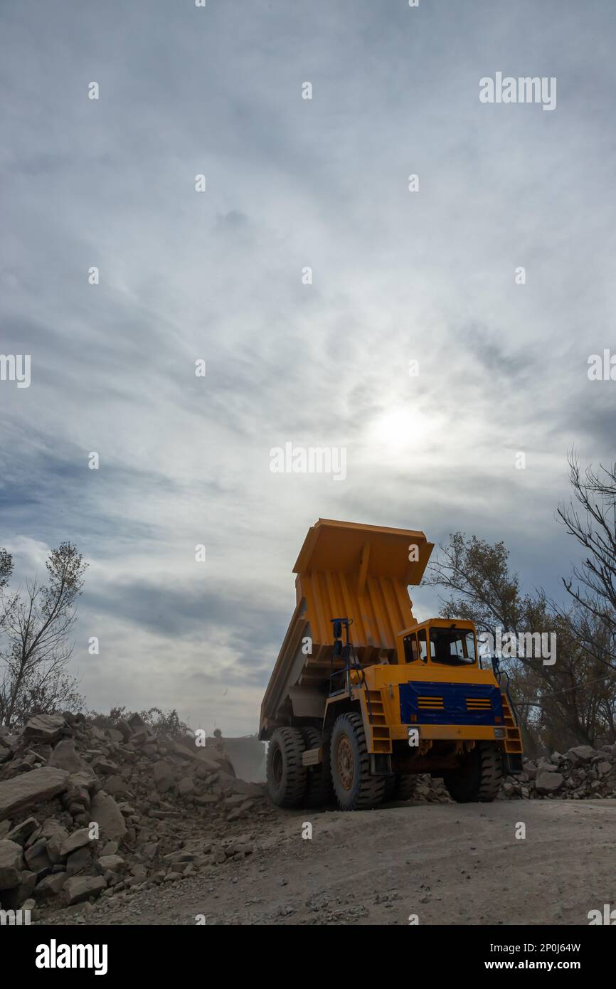 Large mining dump truck. Transport industry. Extraction of stone in an ...