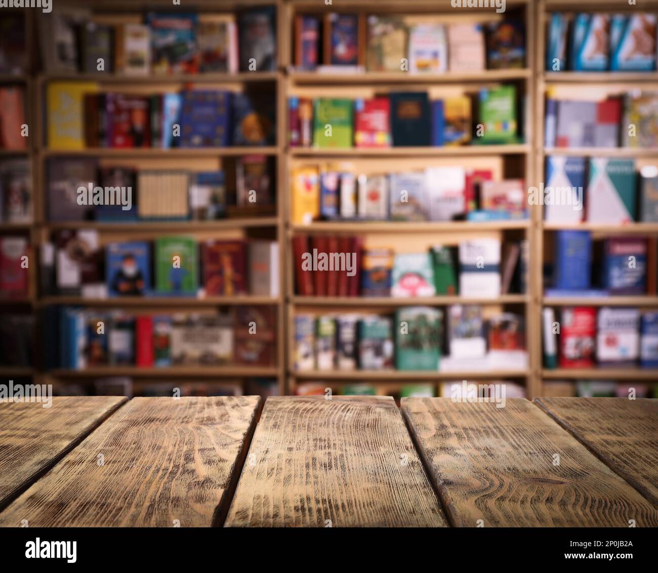 Empty wooden table in library. Space for design Stock Photo - Alamy