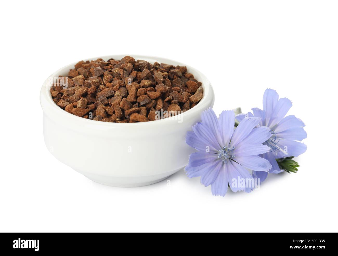 Bowl of chicory granules and flowers on white background Stock Photo ...