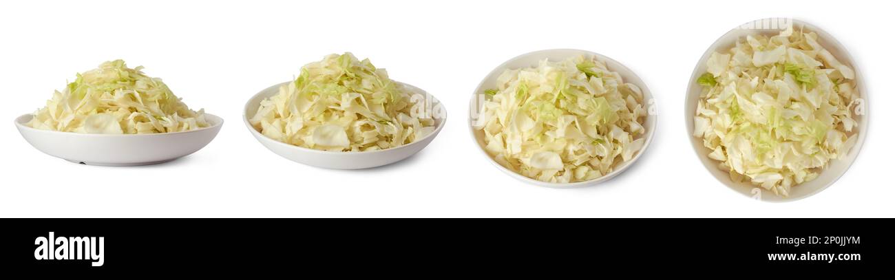 set of bowl or plate full of chopped green cabbage leaves, white and ...
