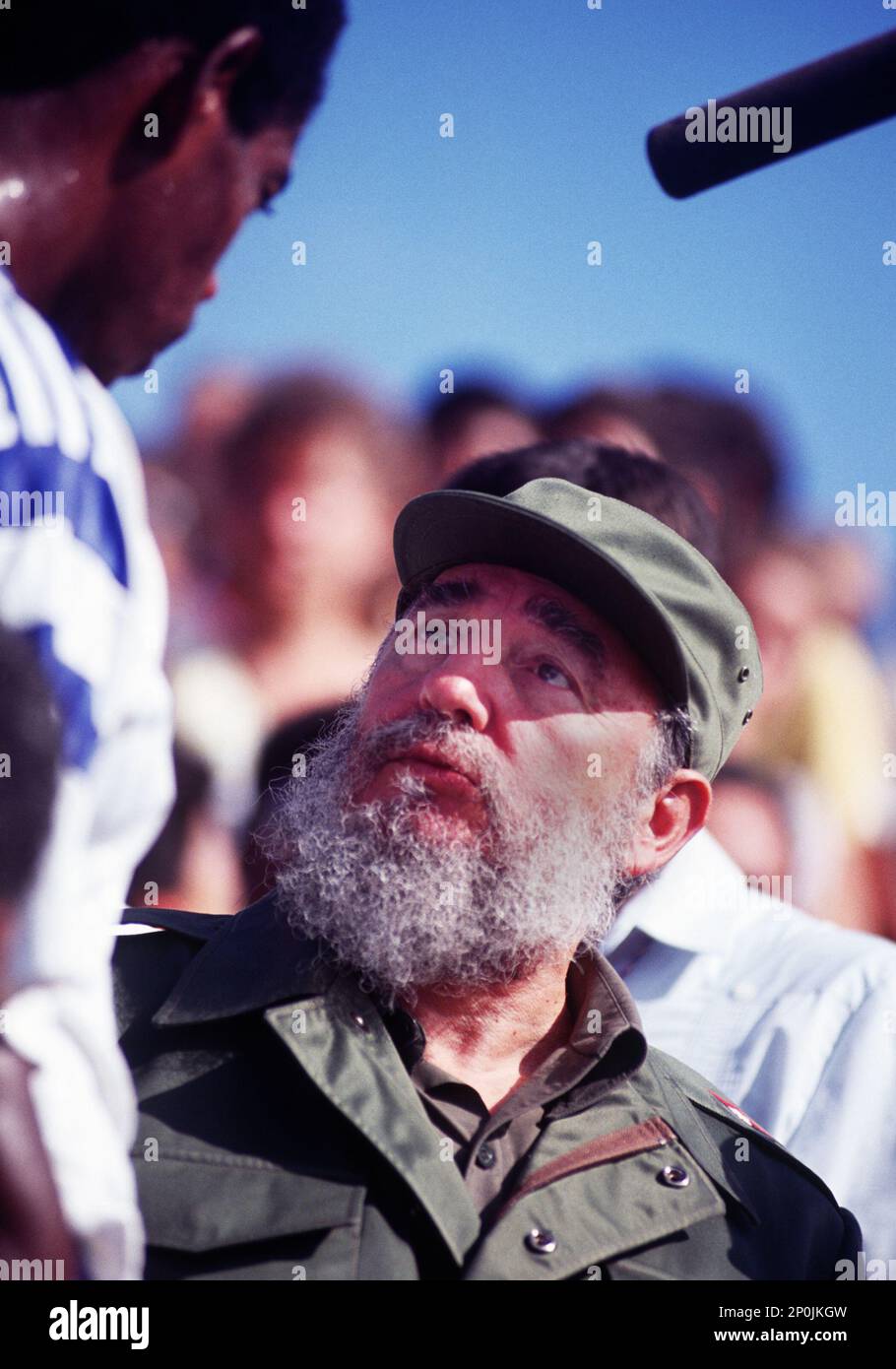 Former Cuban Prime Minister Fidel Castro talks to a competitor during ...