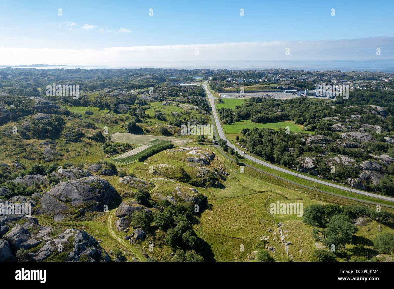 view of the beautiful green forest in norway with the blue sky and ...
