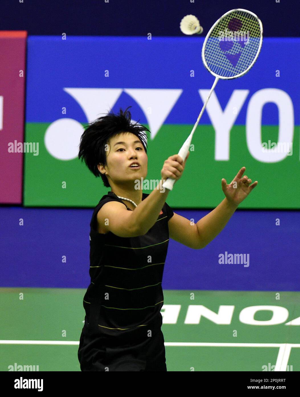 Yip Pui-yin of Hong Kong plays a return shot to Carolina Marin of Spain ...