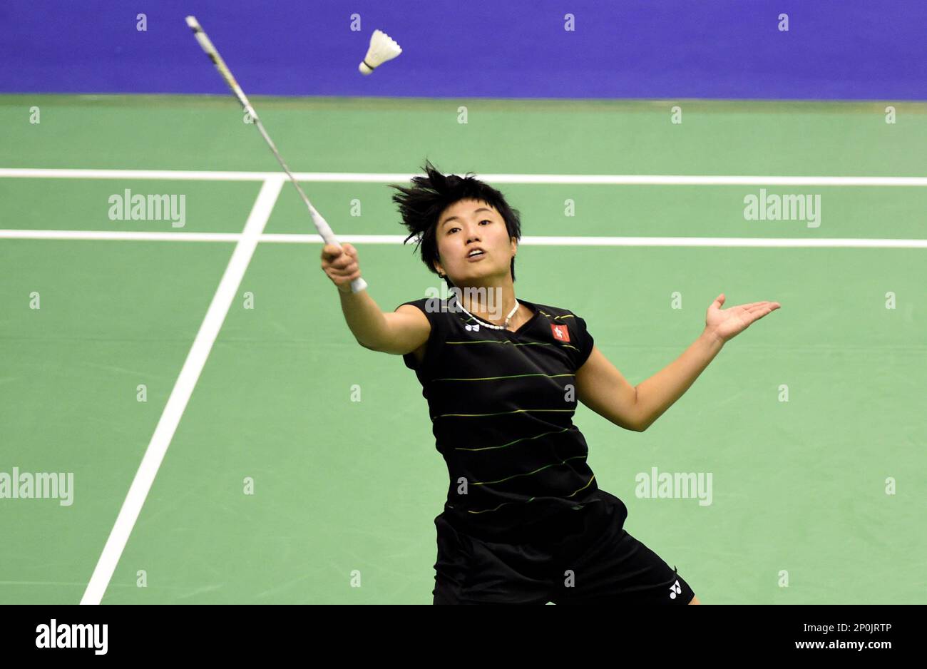 Yip Pui-yin of Hong Kong plays a return shot to Carolina Marin of Spain ...