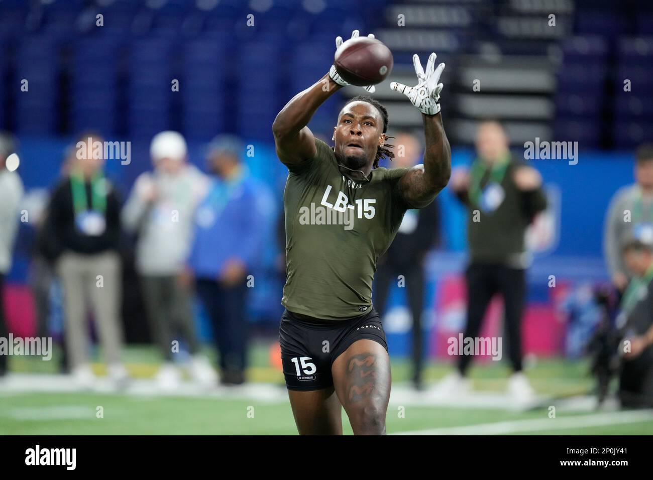 Indiana linebacker Cam Jones runs a drill at the NFL football scouting ...