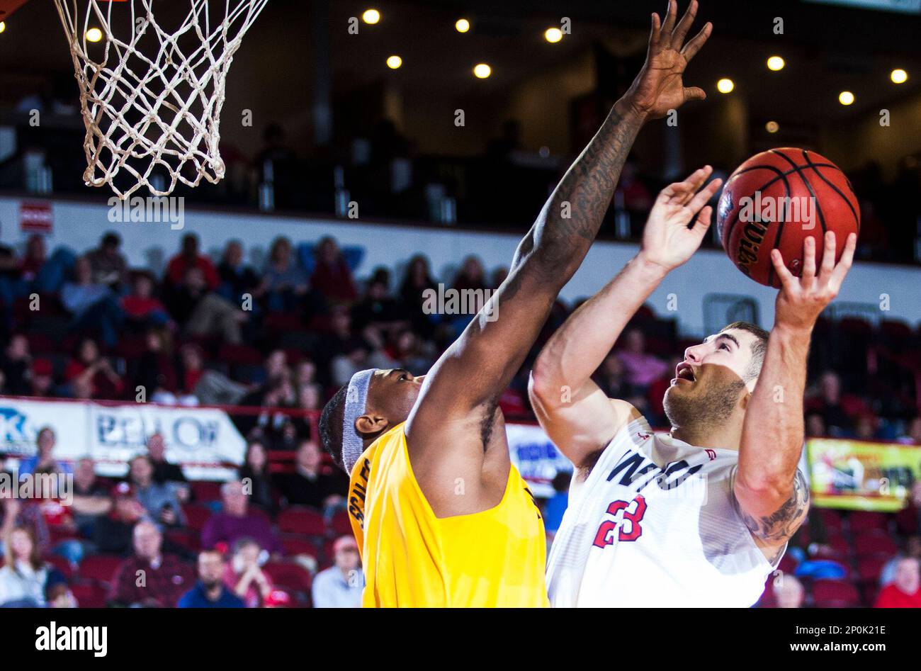 Western Kentucky forward Justin Johnson (23) shoots while guarded by ...