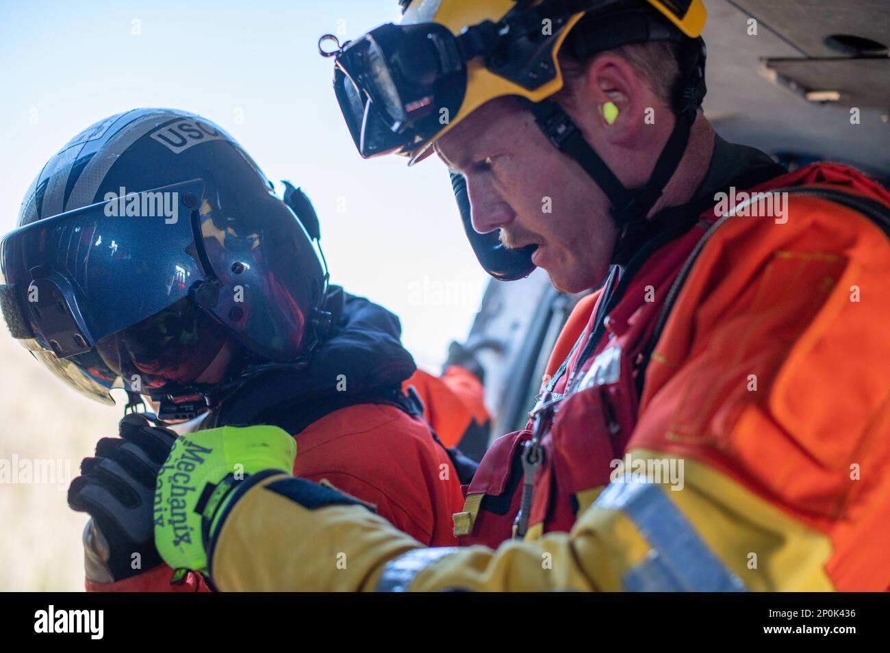Petty Officer 2nd Class Hunter Simpson, a flight mechanic assigned to ...