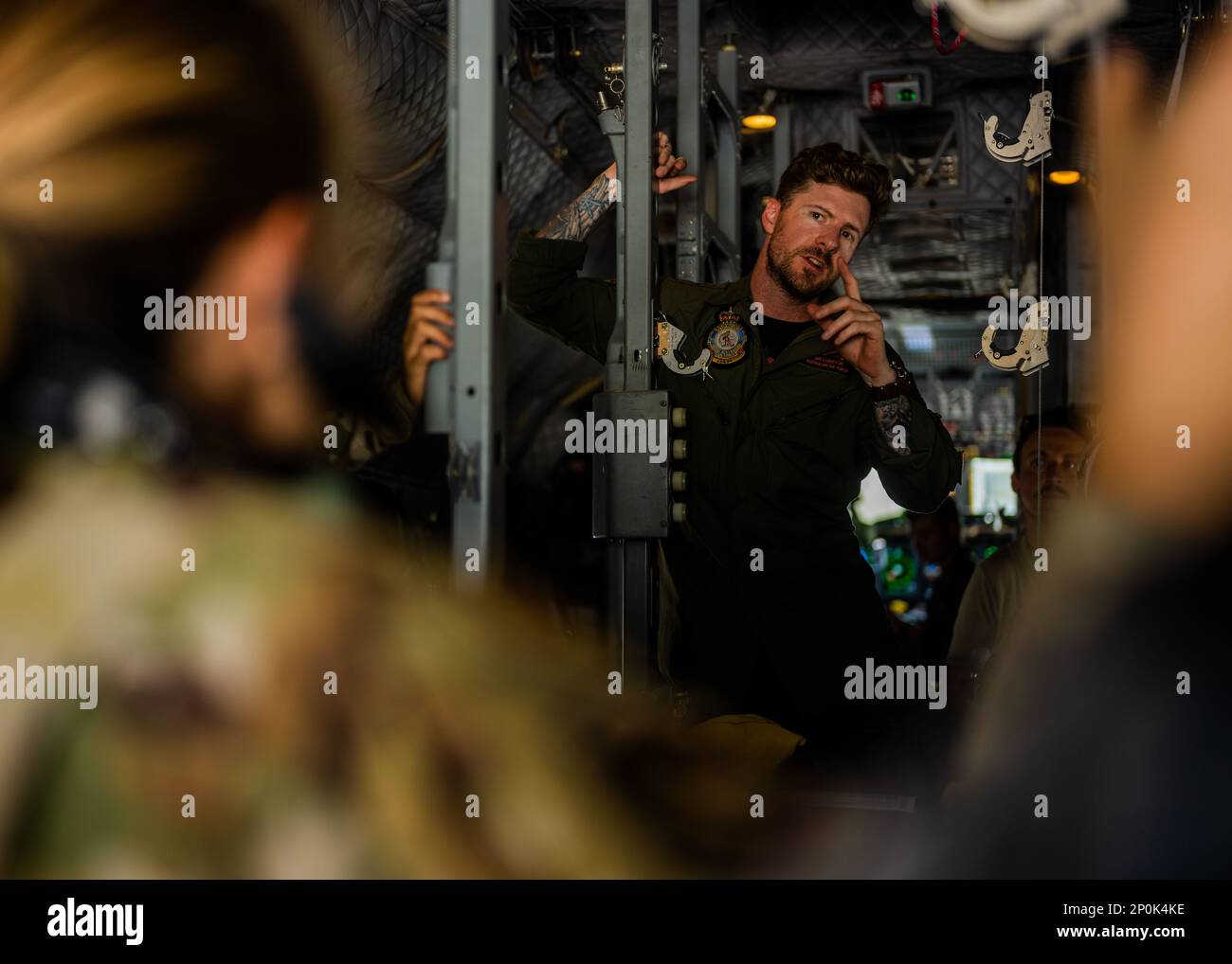 Royal Australian Air Force Sergeant Robert McGavock, loadmaster, gives ...