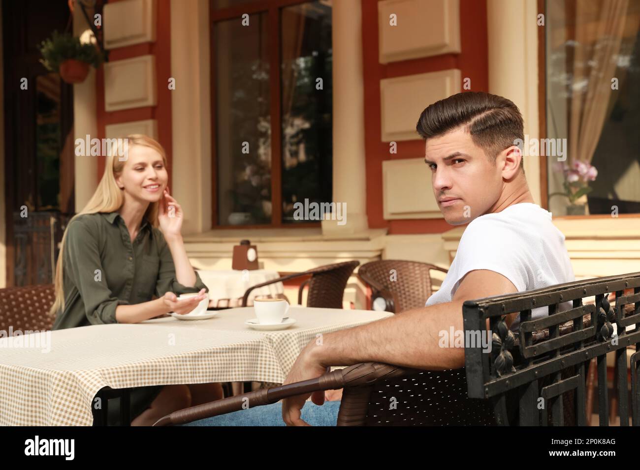 Man having boring date with talkative woman in outdoor cafe Stock Photo ...