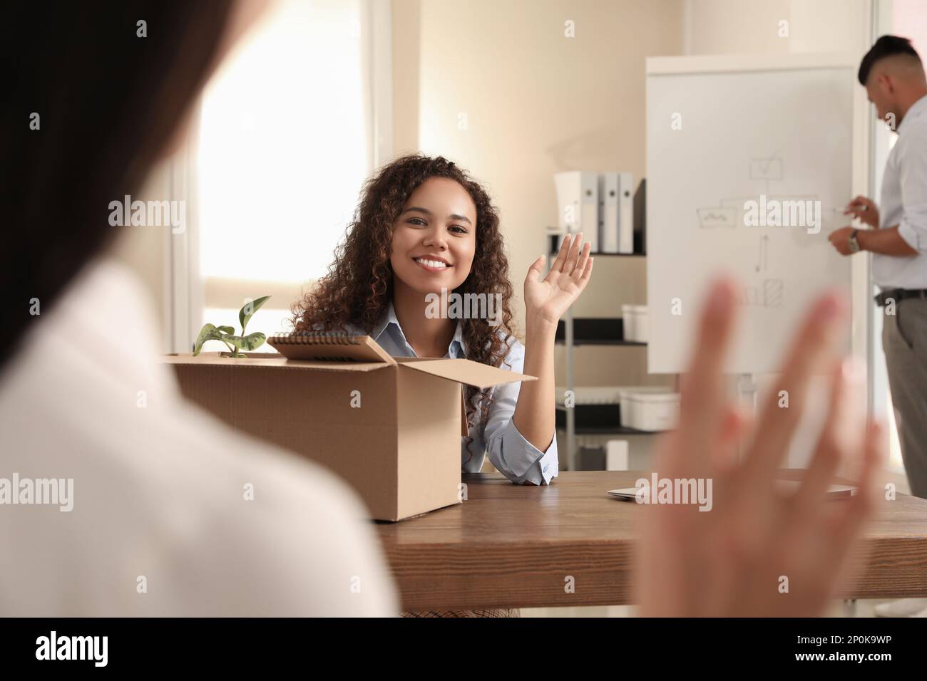 Employee greeting new coworker in modern office Stock Photo - Alamy