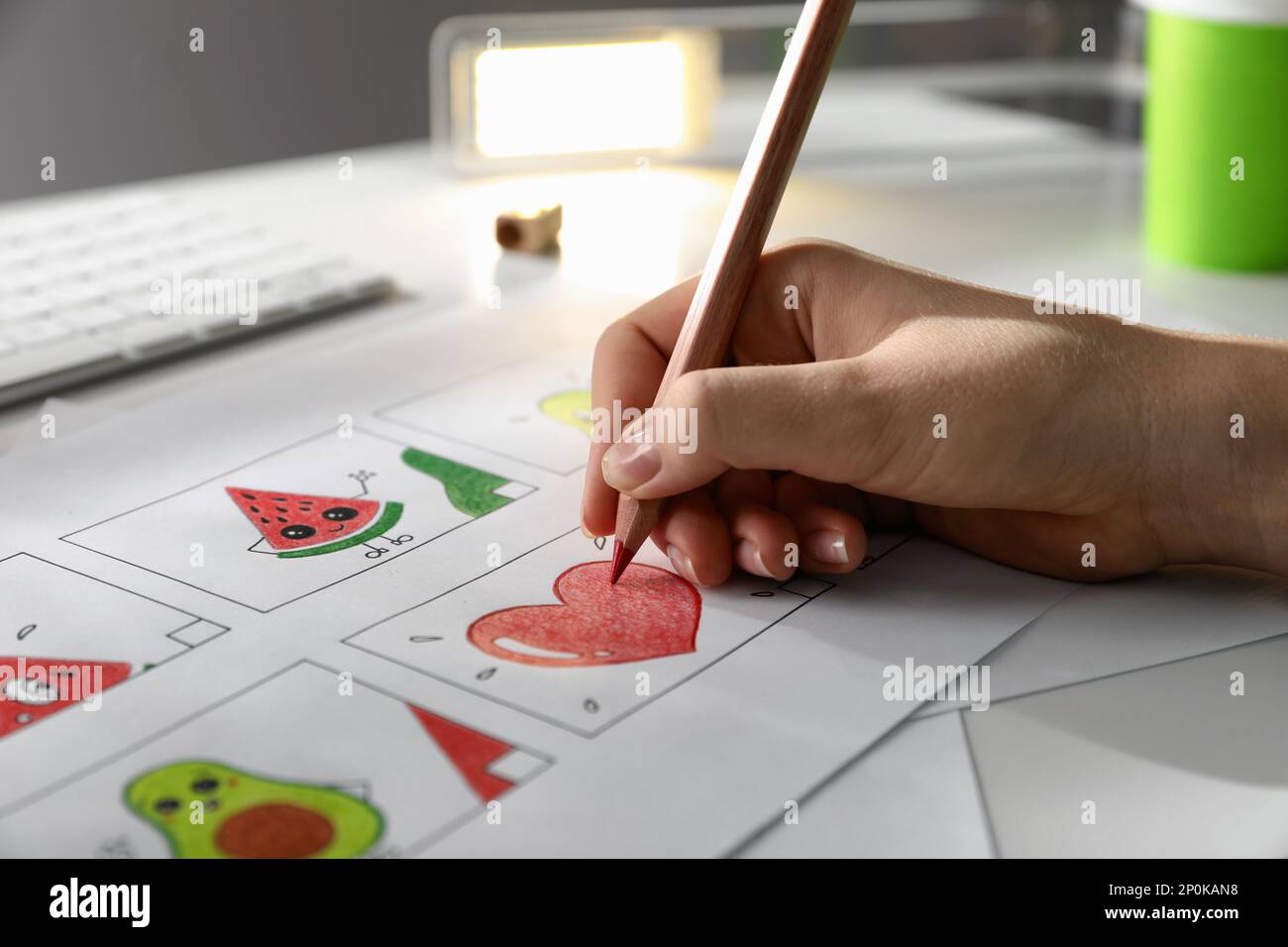 Woman drawing cartoon sketch at workplace, closeup. Pre-production ...