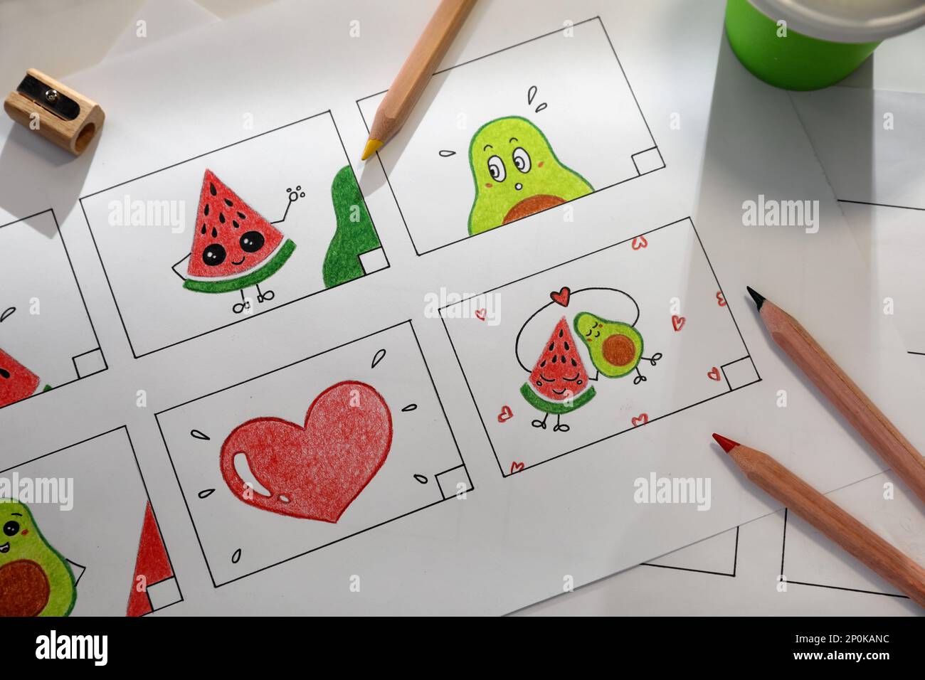 Storyboard with cartoon sketches at workplace, flat lay. Pre-production ...