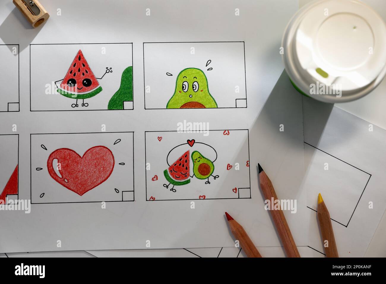 Storyboard with cartoon sketches at workplace, flat lay. Pre-production ...