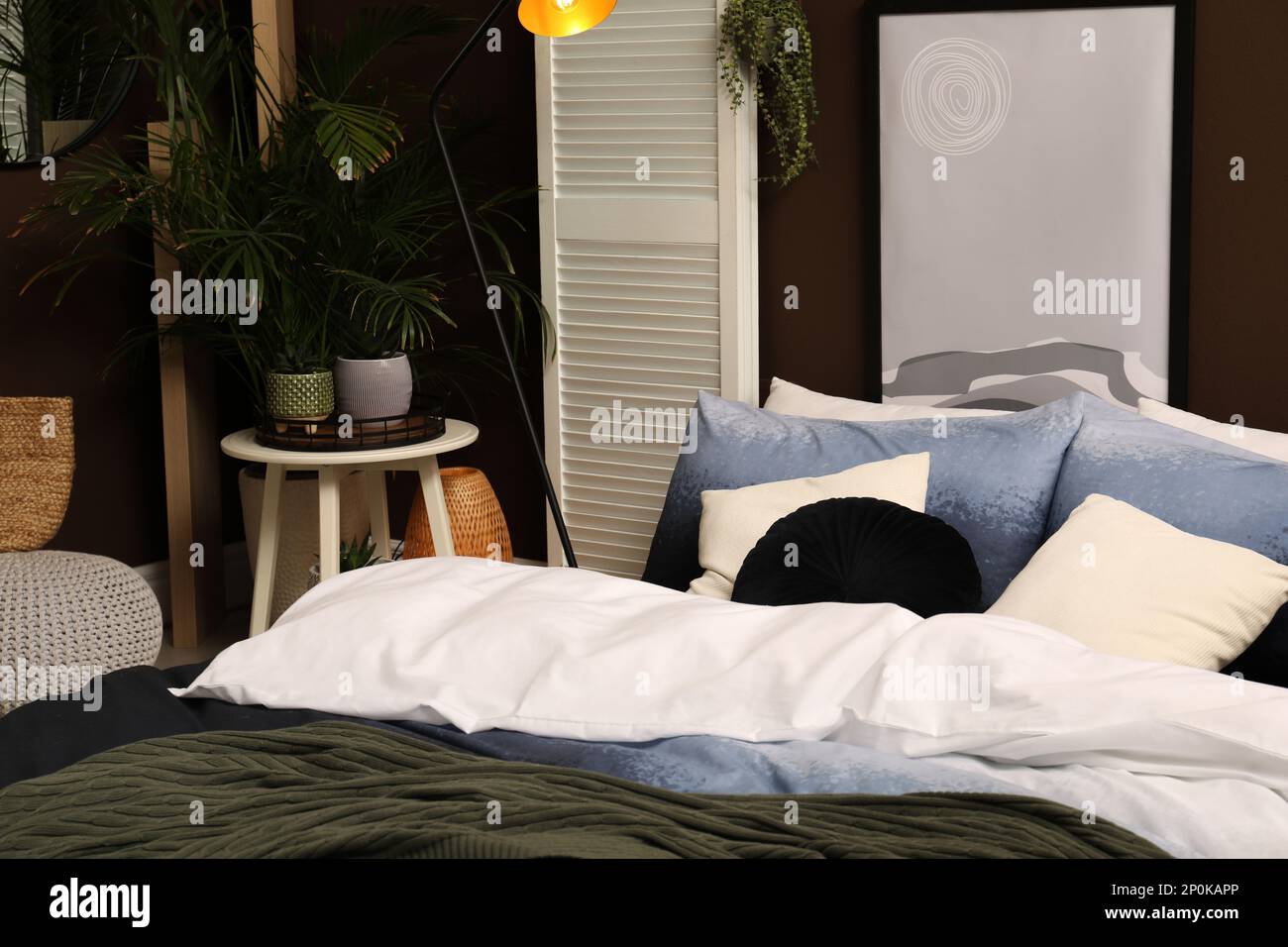 Stylish room with comfortable bed. Interior design Stock Photo - Alamy