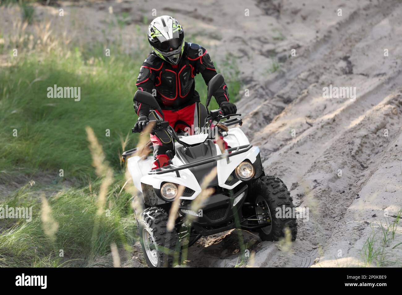Man on quad with helmet hi-res stock photography and images - Alamy