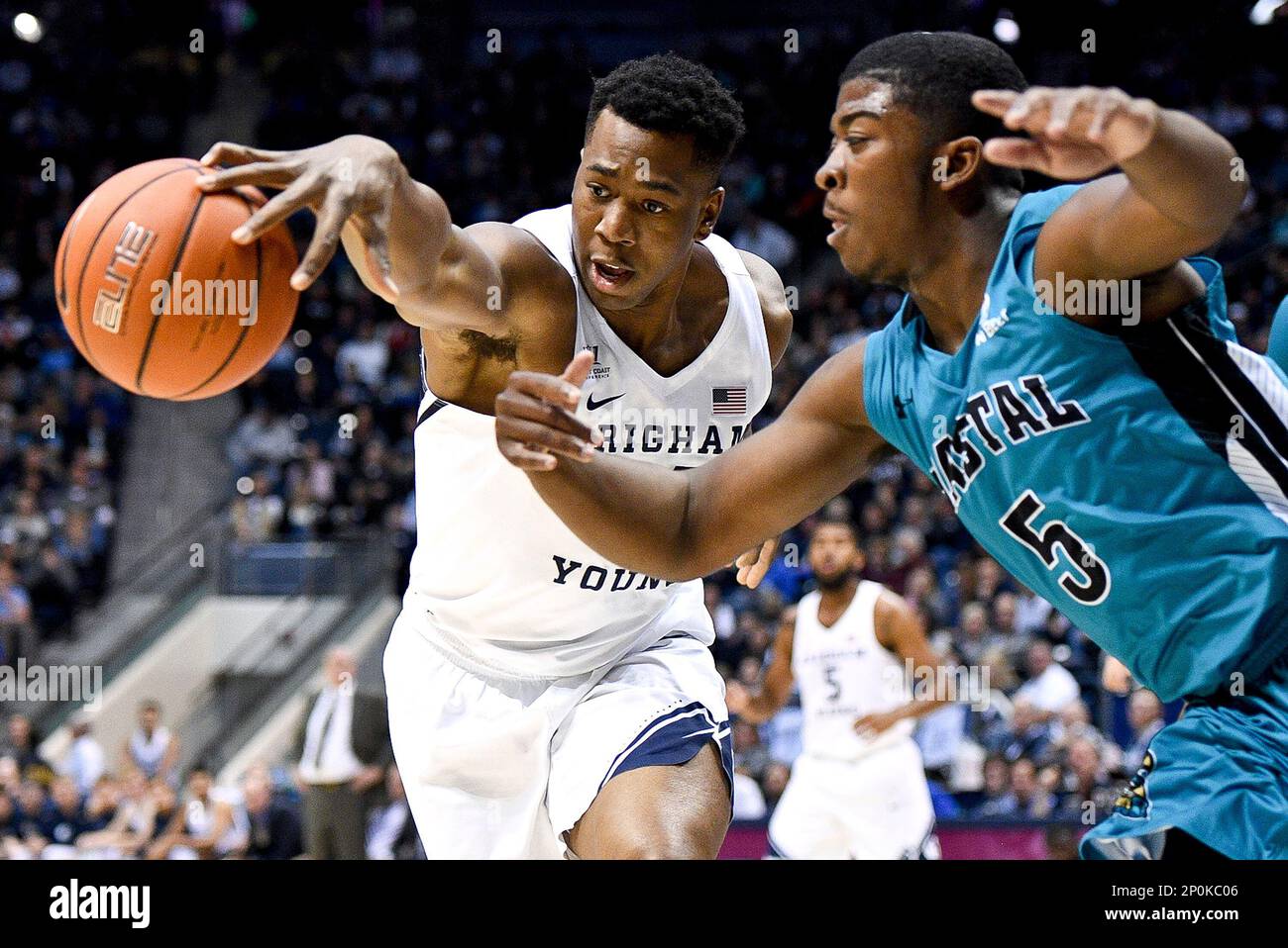 BYU forward Jamal Aytes (40) and Coastal Carolina guard Jaylen Shaw (5 ...