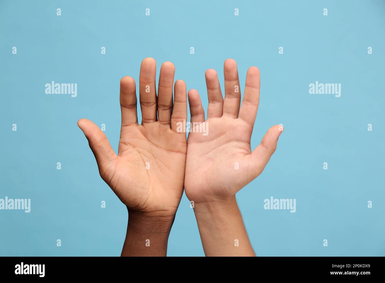 Men showing hands on light blue background, closeup Stock Photo - Alamy