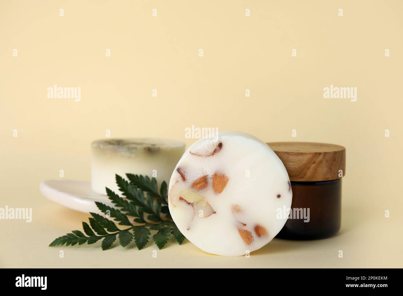 Eco friendly personal care products and green leaf on beige background ...