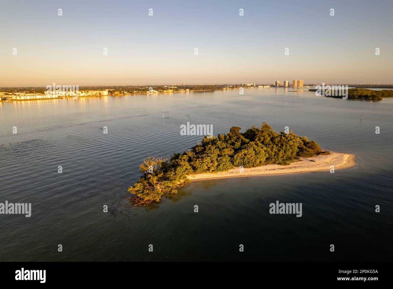 An aerial view of a small island surrounded by waters in North Palm ...