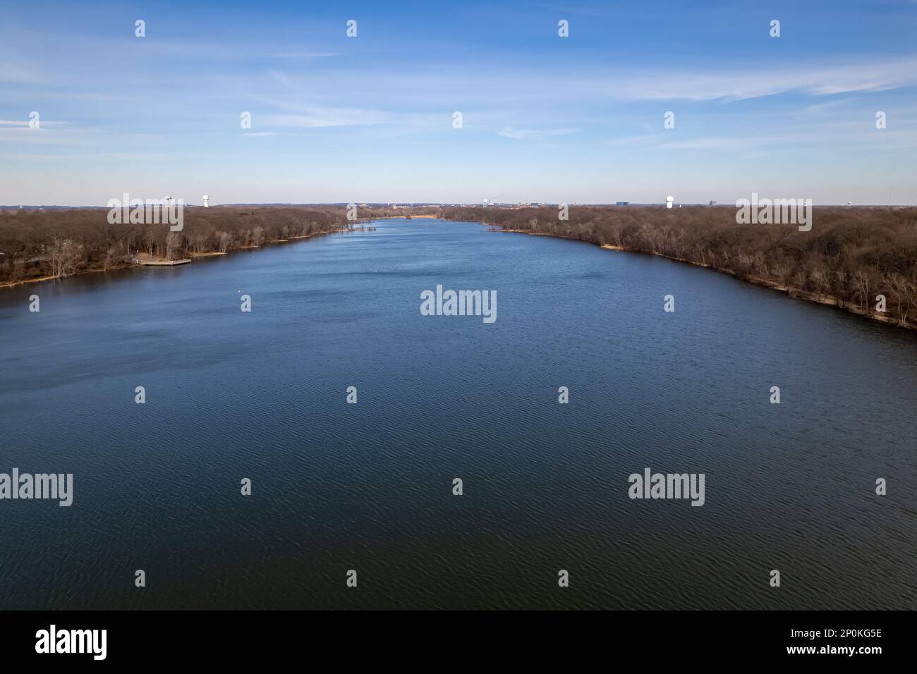 An aerial view of a lake on Long Island, New York surrounded by lush ...